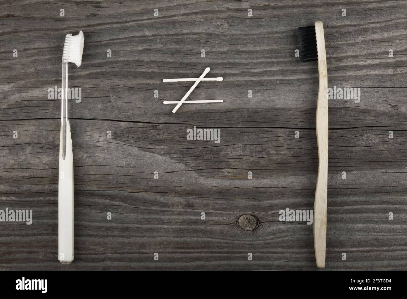 New and used toothbrush on wooden background. Recycling plastic concept ...