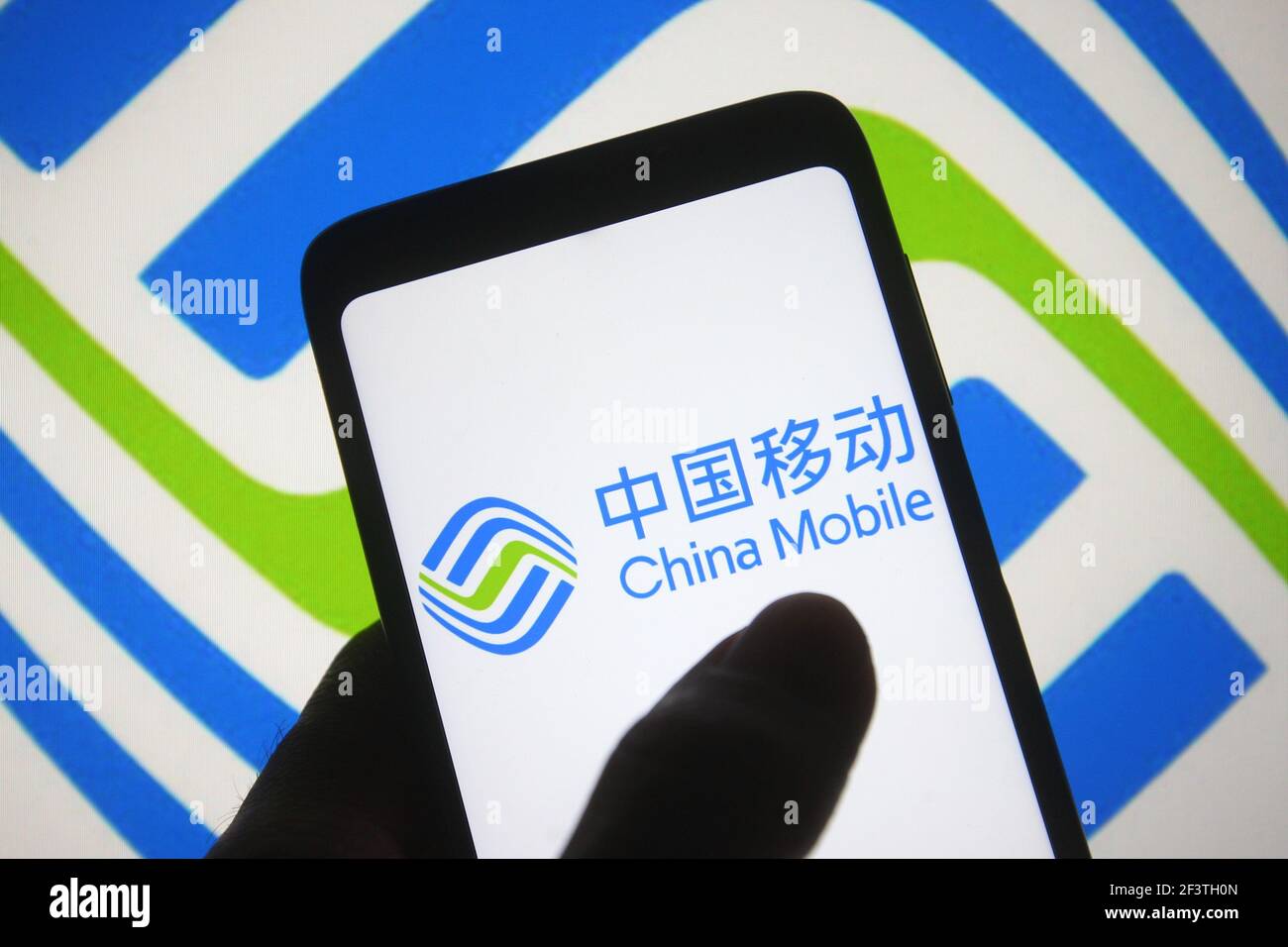 In this photo illustration a China Mobile logo is seen on a smartphone ...