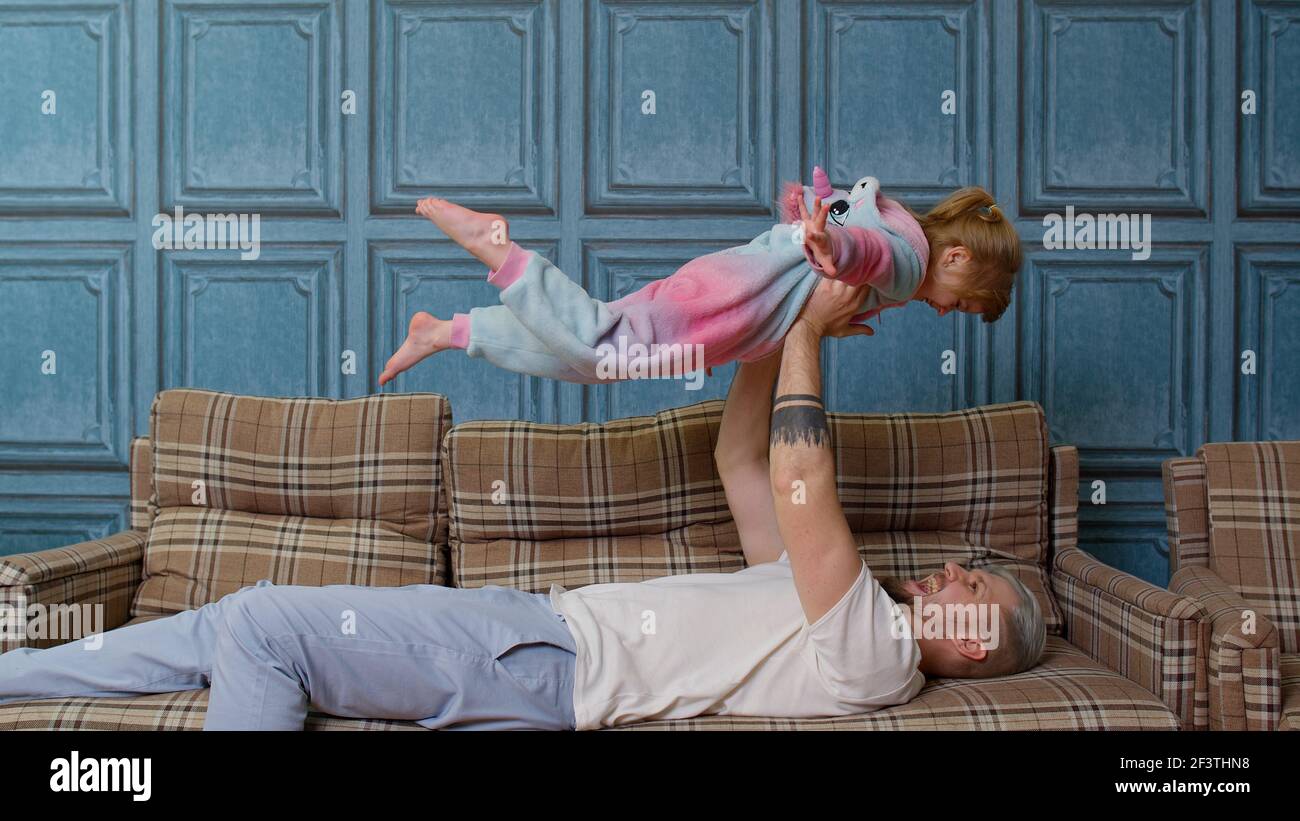 Child girl playing game laughing having fun with father, happy dad ...