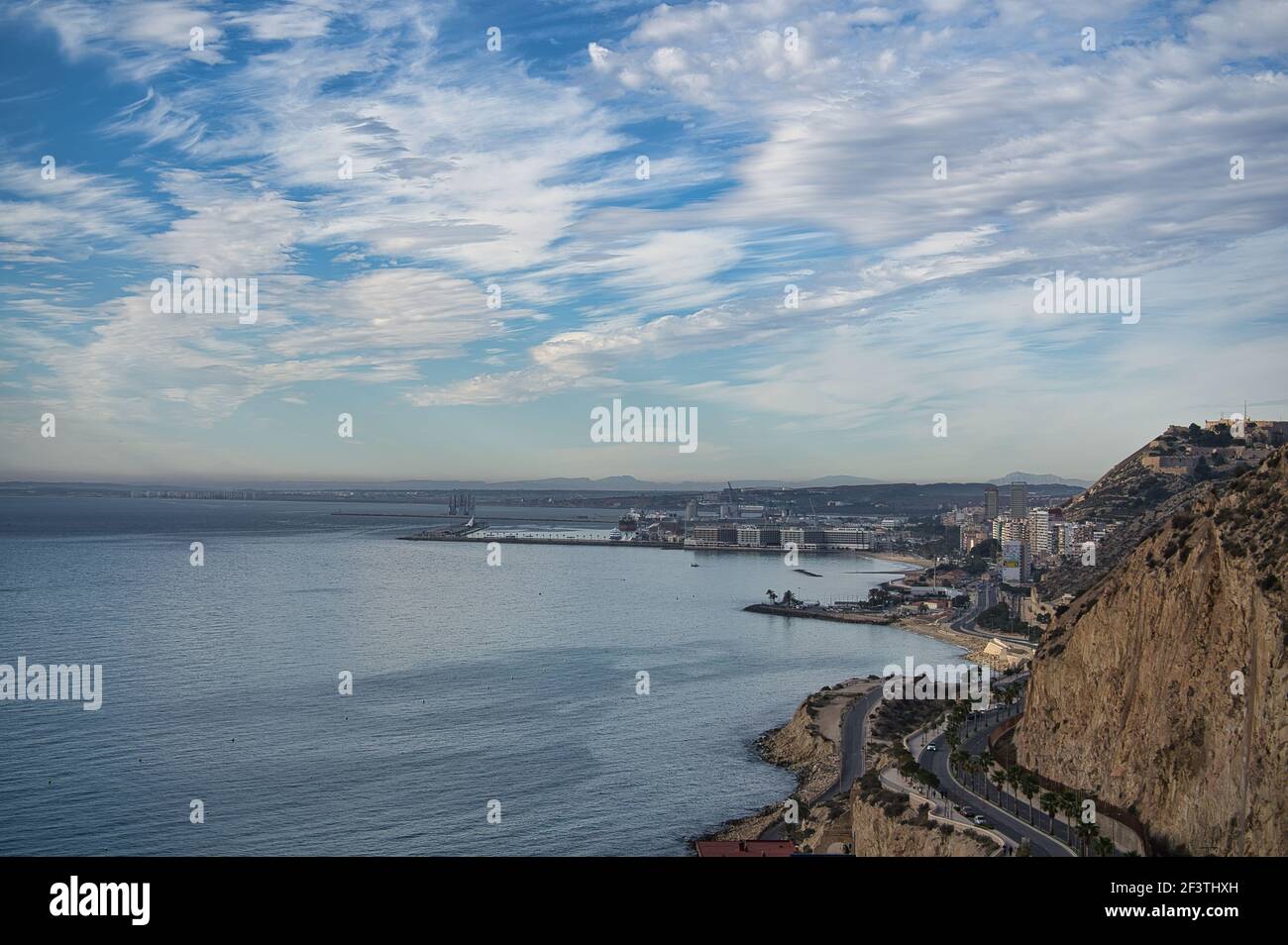 beautiful sunrise on the beach with rocks and clouds, located in ...