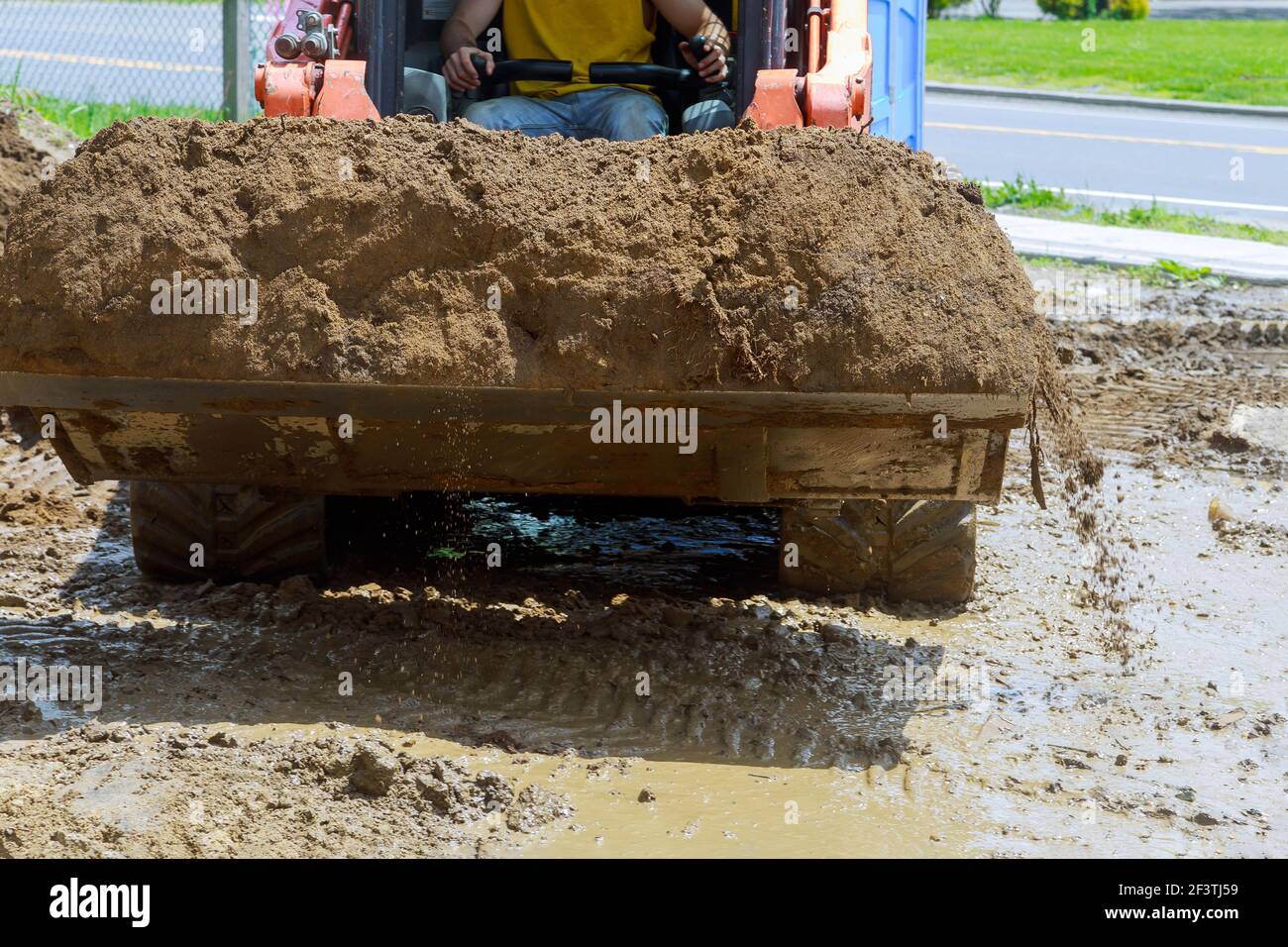 Bulldozer moving, leveling ground at construction site Stock Photo - Alamy