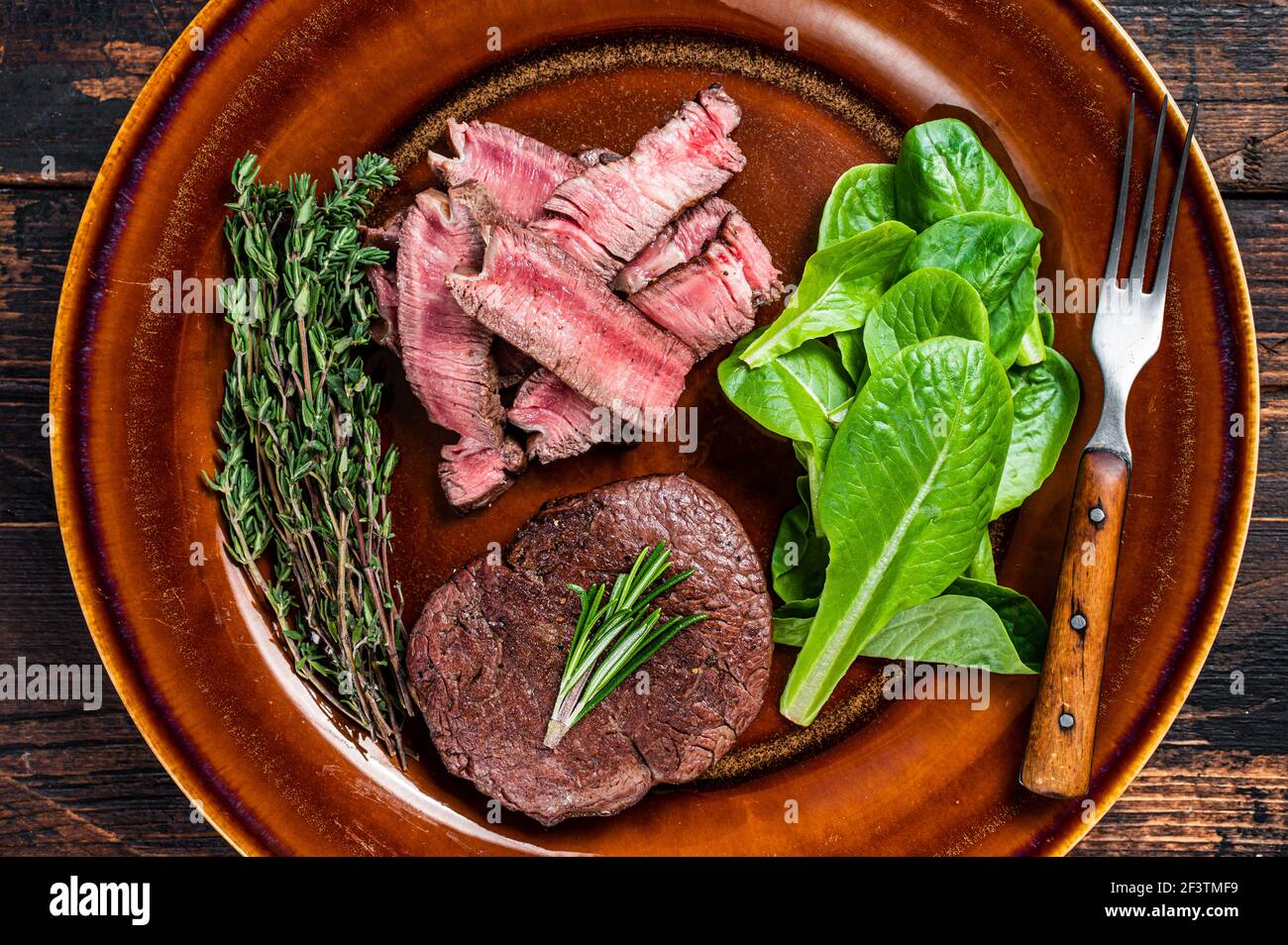 Fillet Mignon tenderloin roast and cut meat beef steaks in a plate with ...