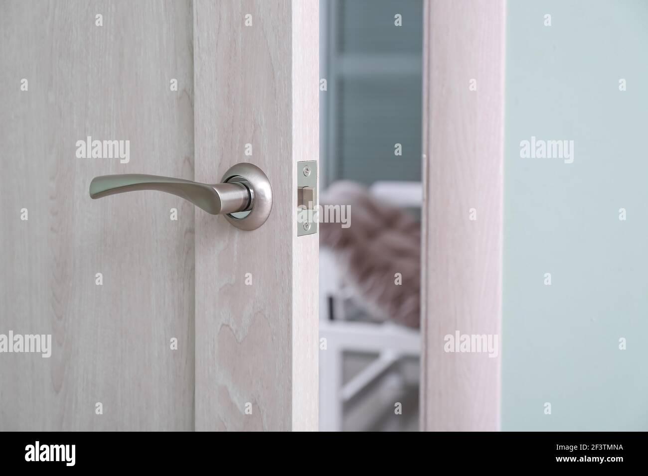 View of living room through open door Stock Photo - Alamy