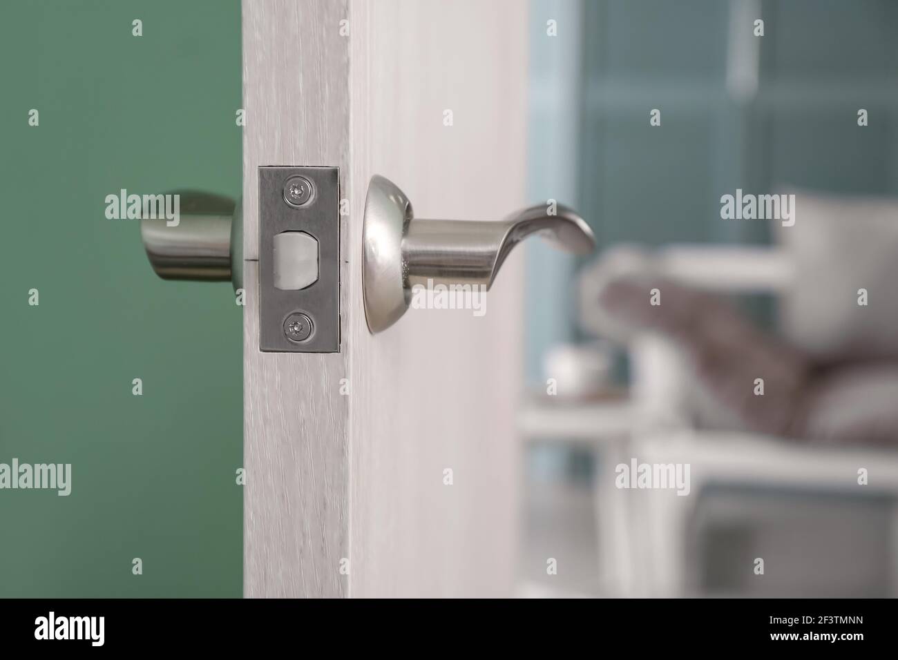 View of living room through open door Stock Photo - Alamy