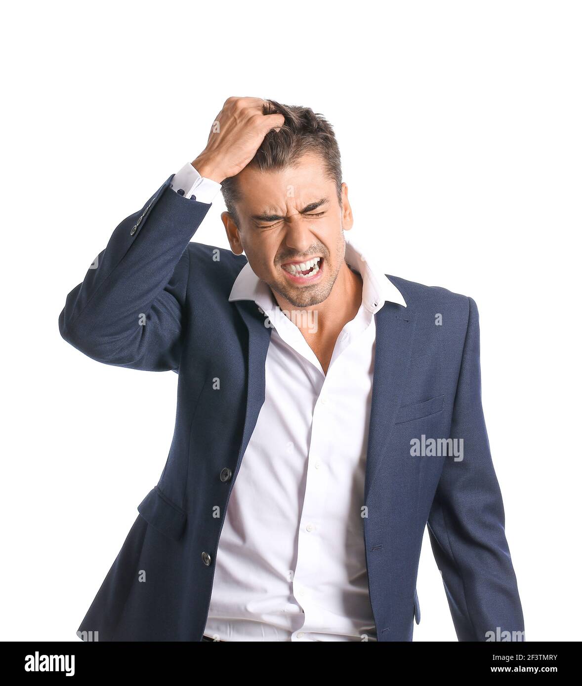 Portrait of stressed young man on white background Stock Photo - Alamy