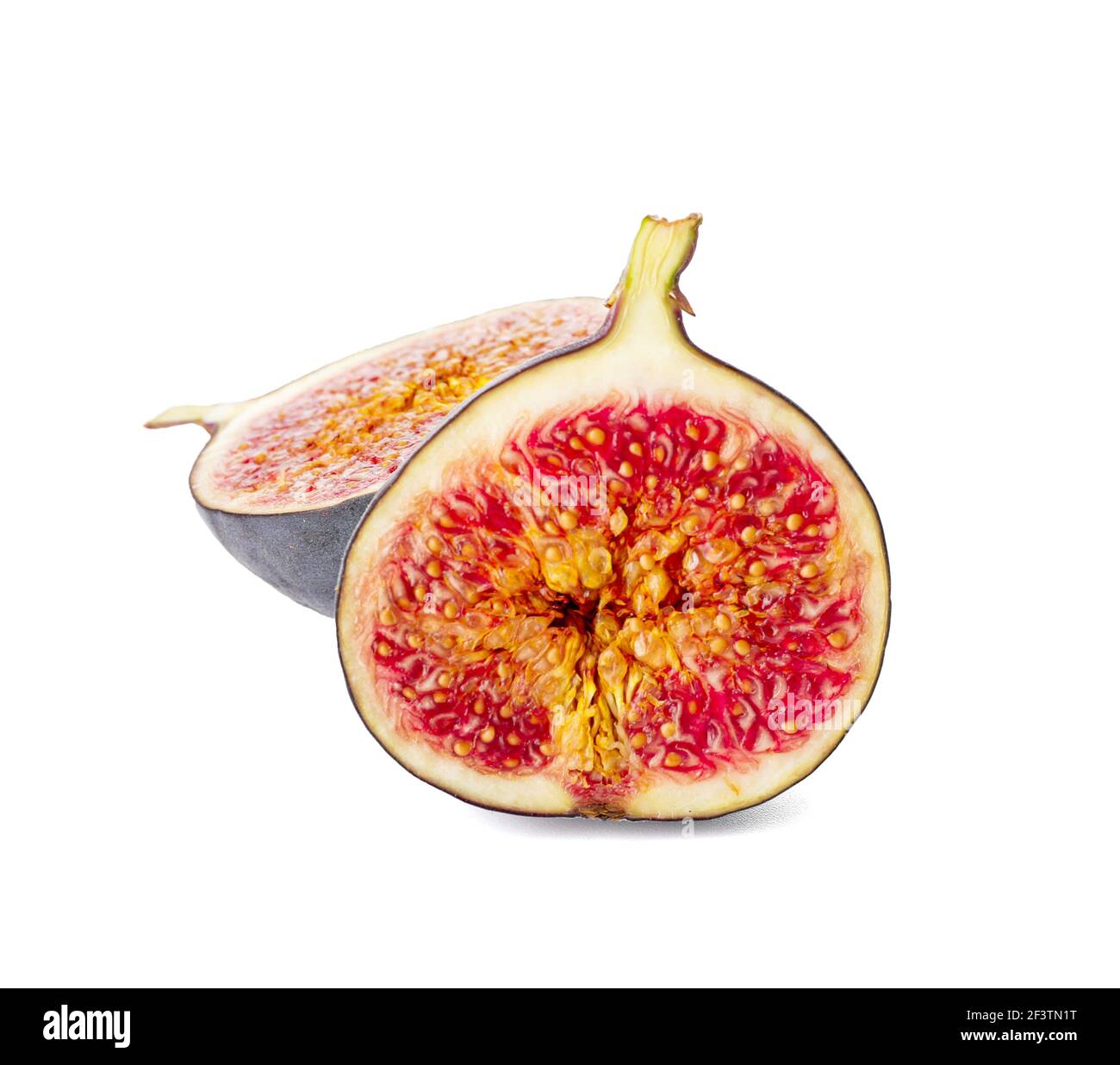 Cut fig fruit on white background Stock Photo - Alamy