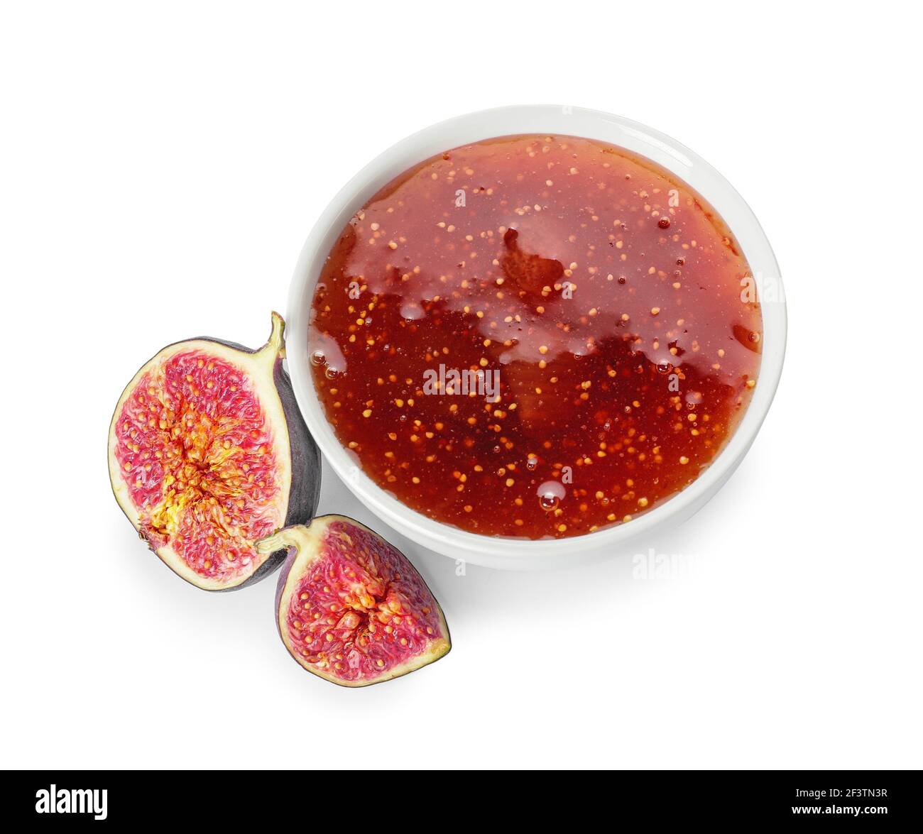 Bowl of sweet fig jam on white background Stock Photo - Alamy