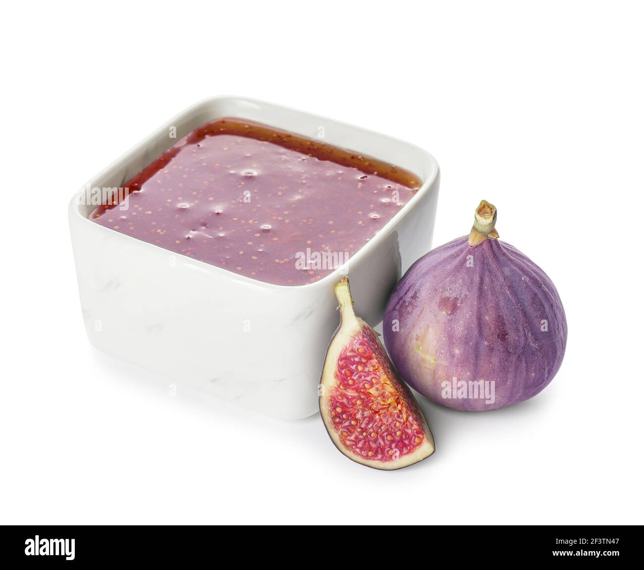 Bowl of sweet fig jam on white background Stock Photo - Alamy