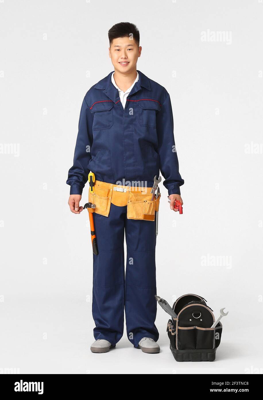 Asian worker on white background Stock Photo - Alamy
