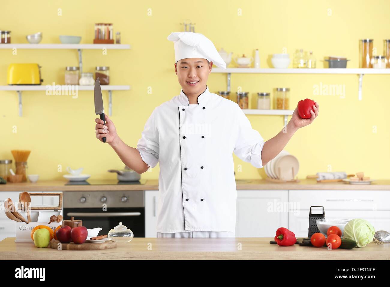 Male Asian chef in kitchen Stock Photo - Alamy