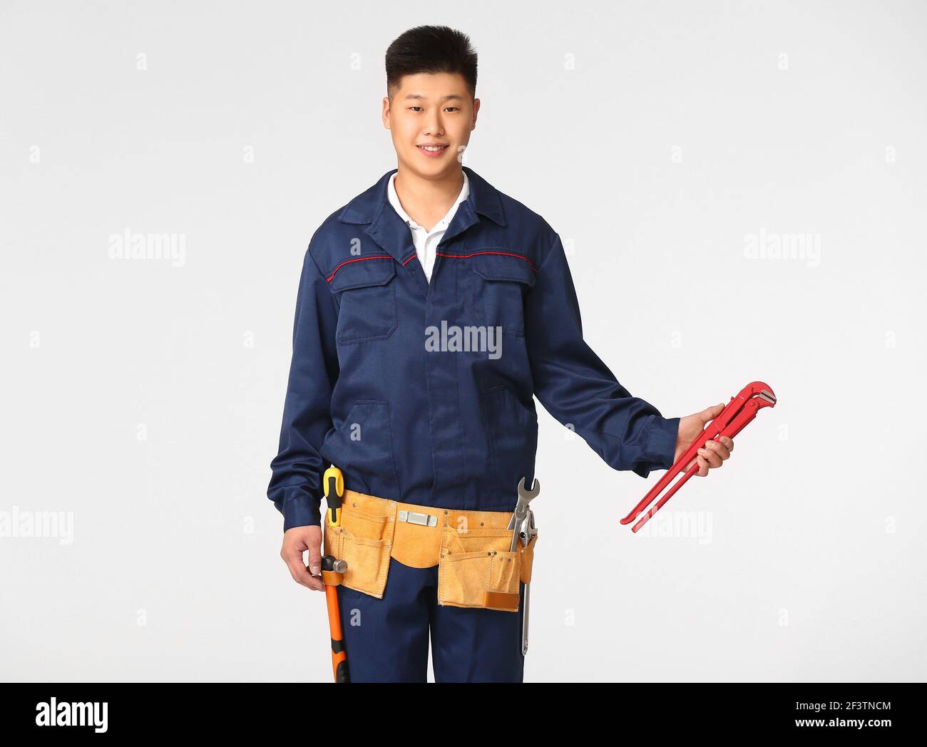 Asian worker on white background Stock Photo - Alamy