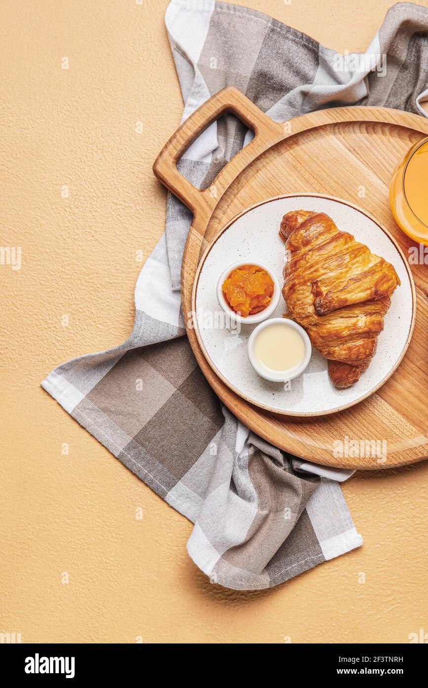 Wooden tray with tasty breakfast on color background Stock Photo - Alamy