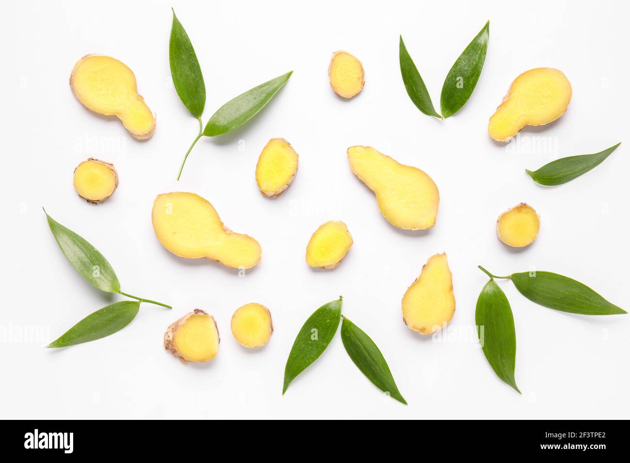 Fresh cut ginger on white background Stock Photo - Alamy