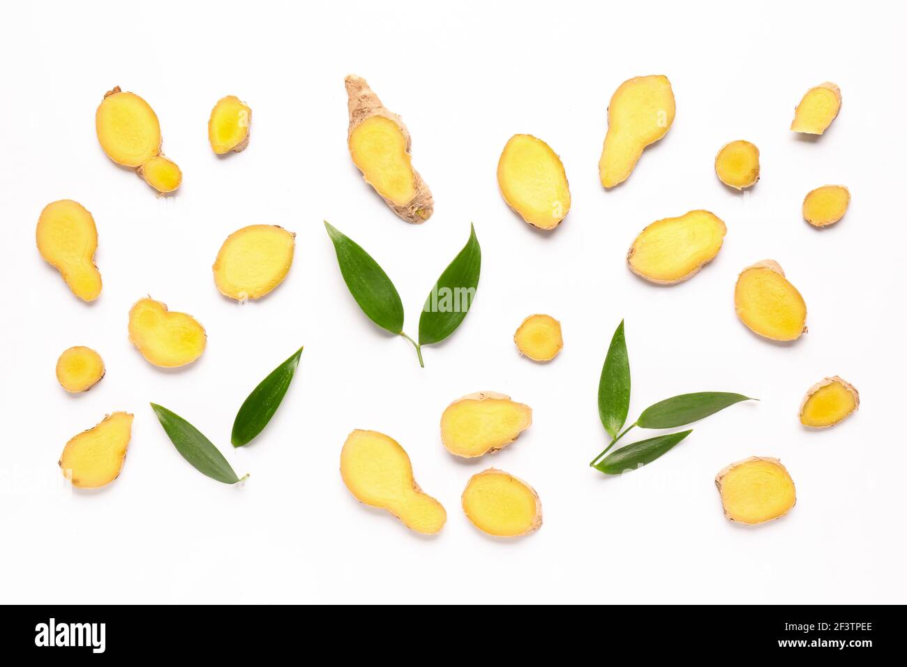 Fresh cut ginger on white background Stock Photo - Alamy