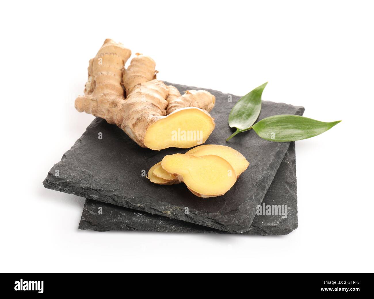 Fresh ginger and slate plates on white background Stock Photo - Alamy