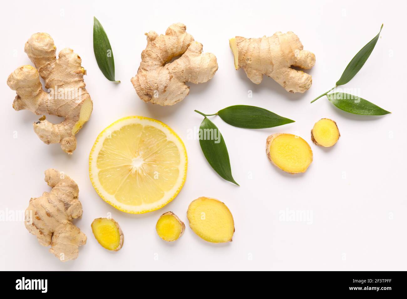 Fresh ginger and lemon on white background Stock Photo - Alamy
