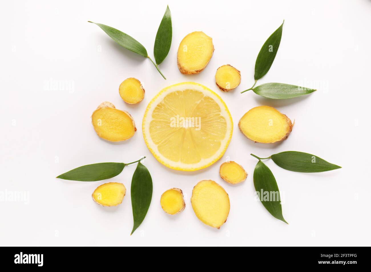 Fresh cut ginger and lemon on white background Stock Photo - Alamy