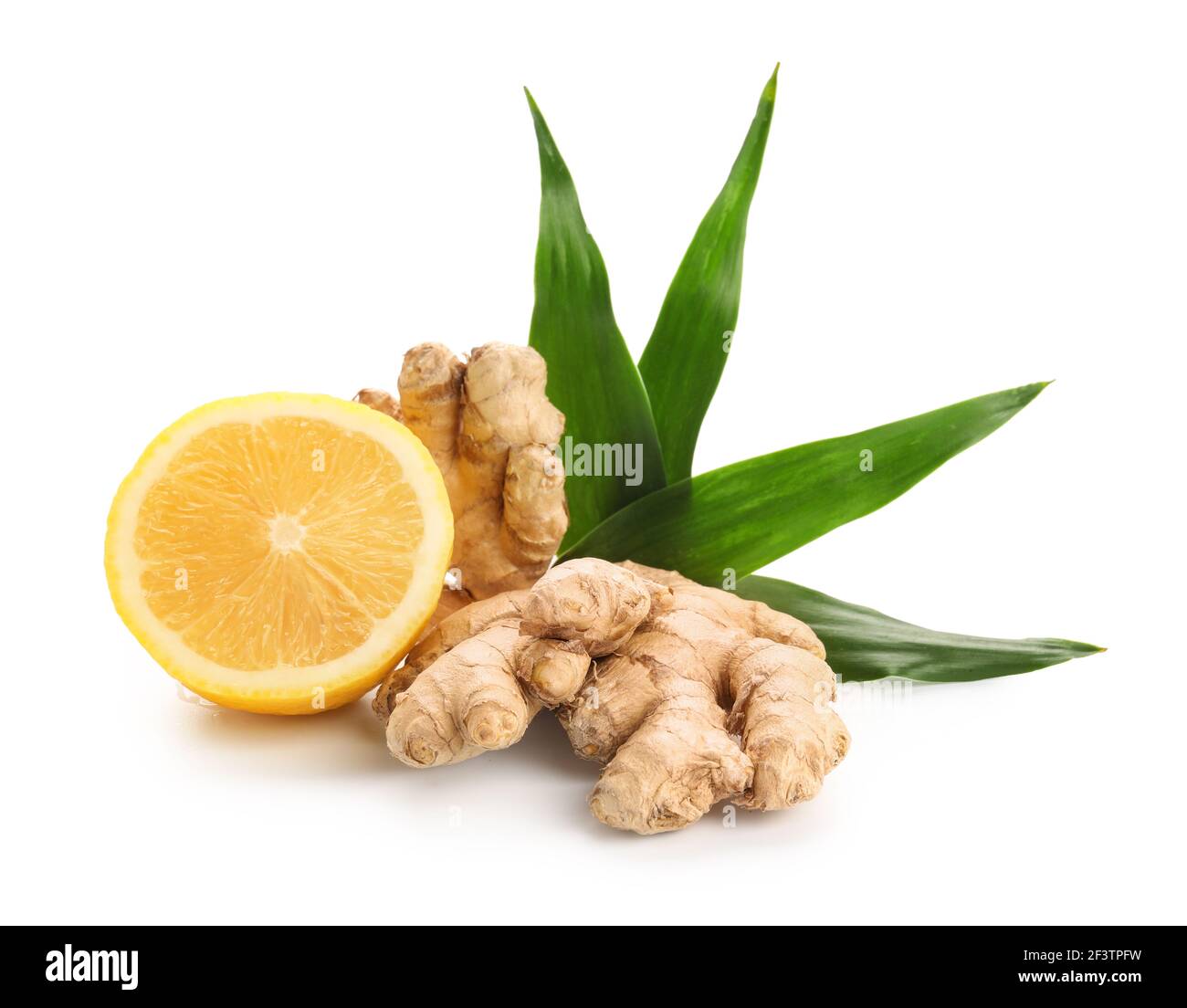 Fresh ginger and lemon on white background Stock Photo - Alamy