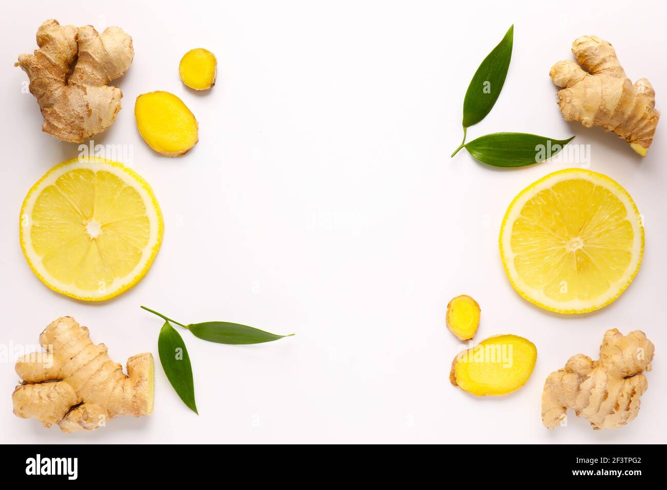 Fresh ginger and lemon on white background Stock Photo - Alamy