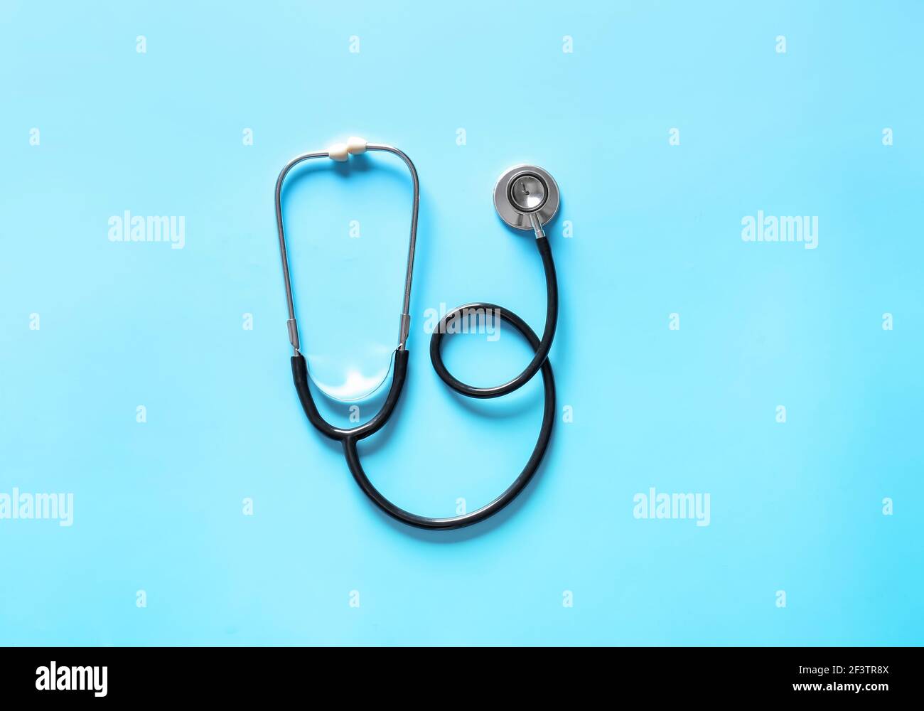 Modern stethoscope on color background Stock Photo - Alamy