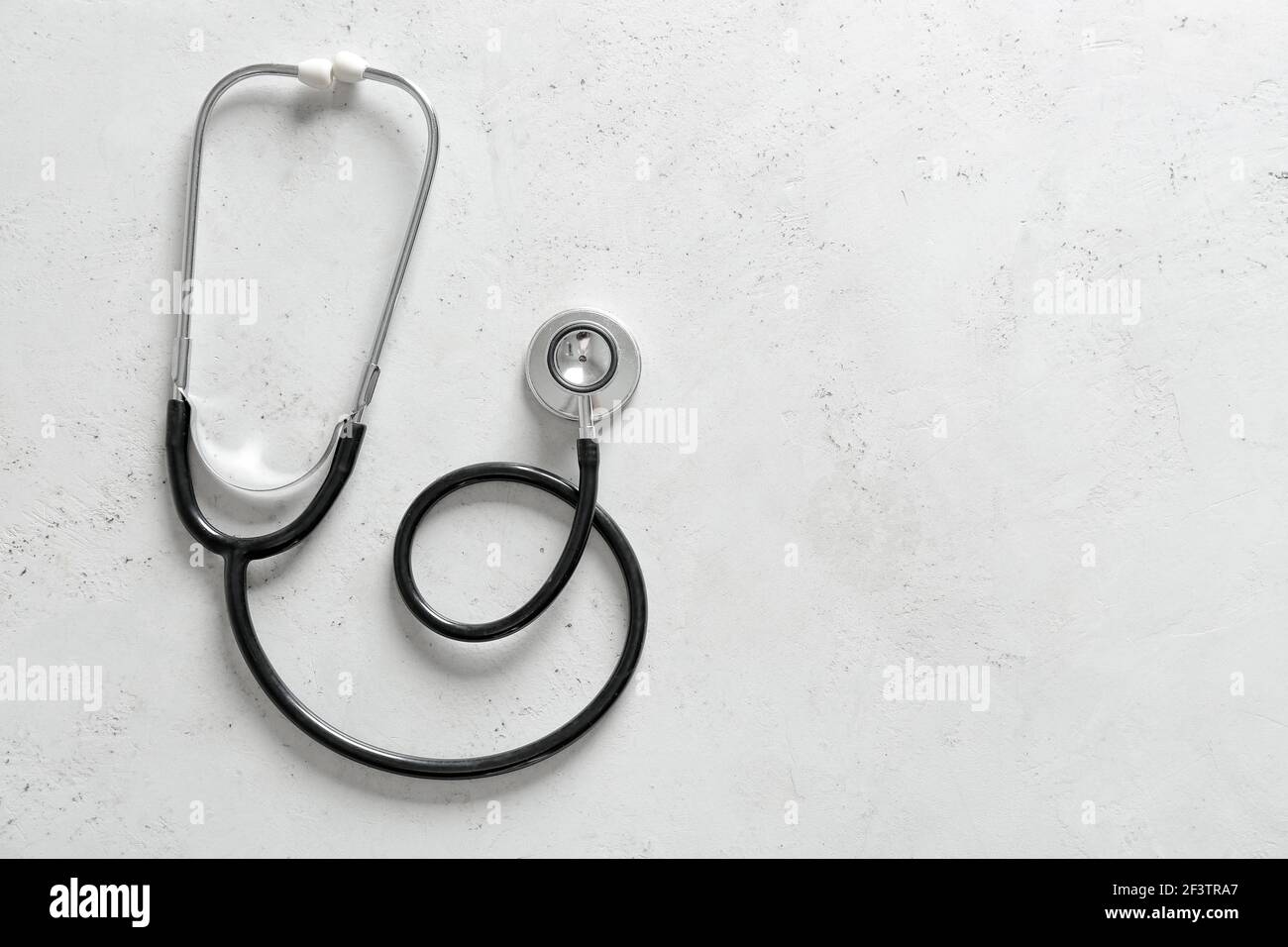 Modern stethoscope on light background Stock Photo - Alamy