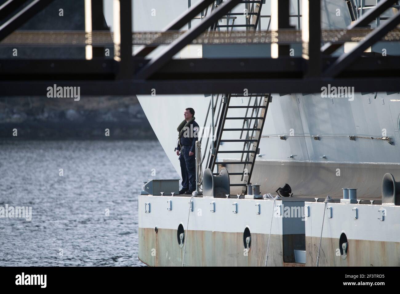 Finnart, Loch Long, Scotland, UK. 17 March 2021. Royal Navy crew member ...