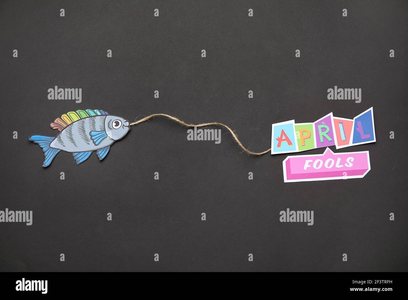 Paper fish on dark background. April Fools Day celebration Stock Photo ...