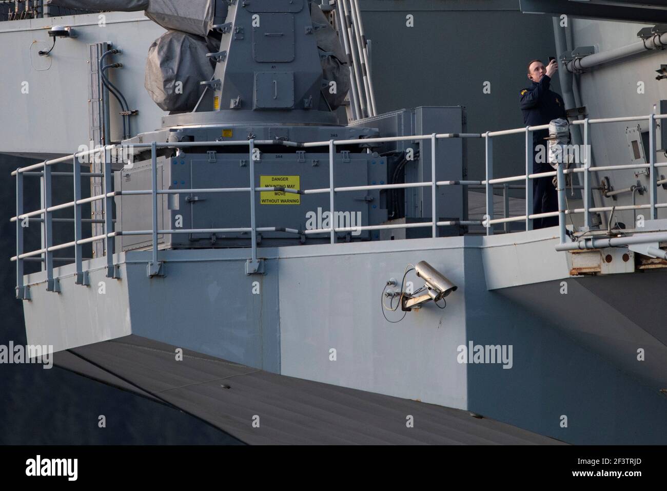Finnart, Loch Long, Scotland, UK. 17 March 2021. Royal Navy crew member ...