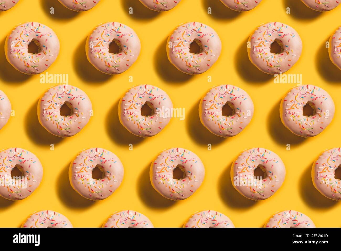 Seamless Doughnut Pattern on bright illuminating background Stock Photo ...