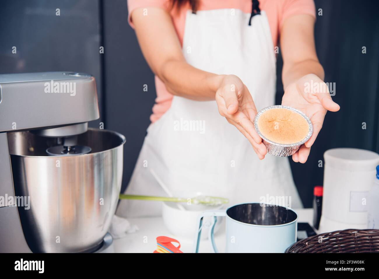 Beautiful woman show bakery cake holding on hands at homemade Stock ...