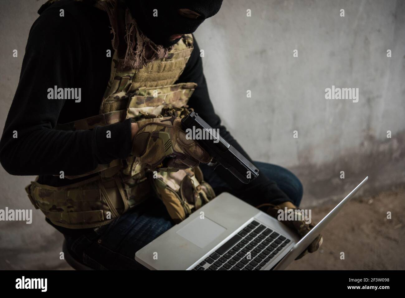 Terrorist man cyber hacker hacking internet to access steal information ...