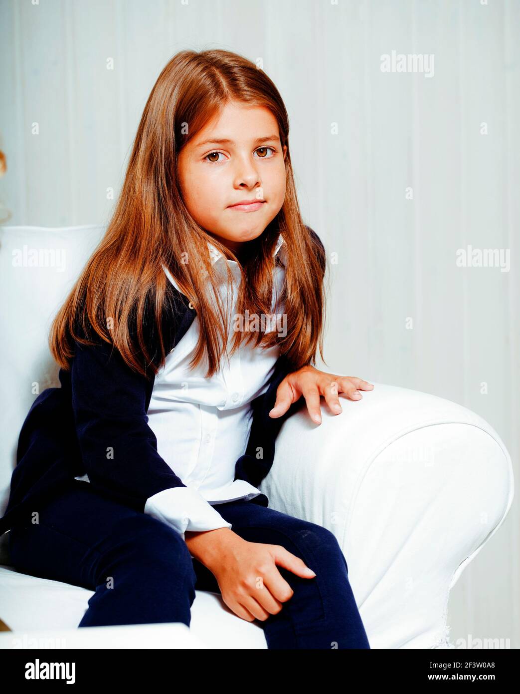 little cute brunette girl at home interior happy smiling close up ...