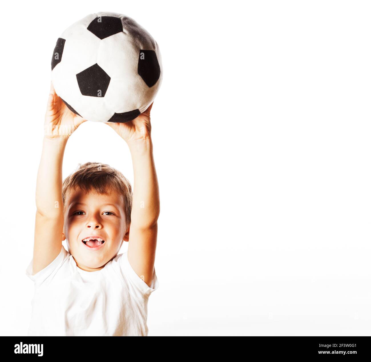 little cute boy playing football ball isolated on white close up ...