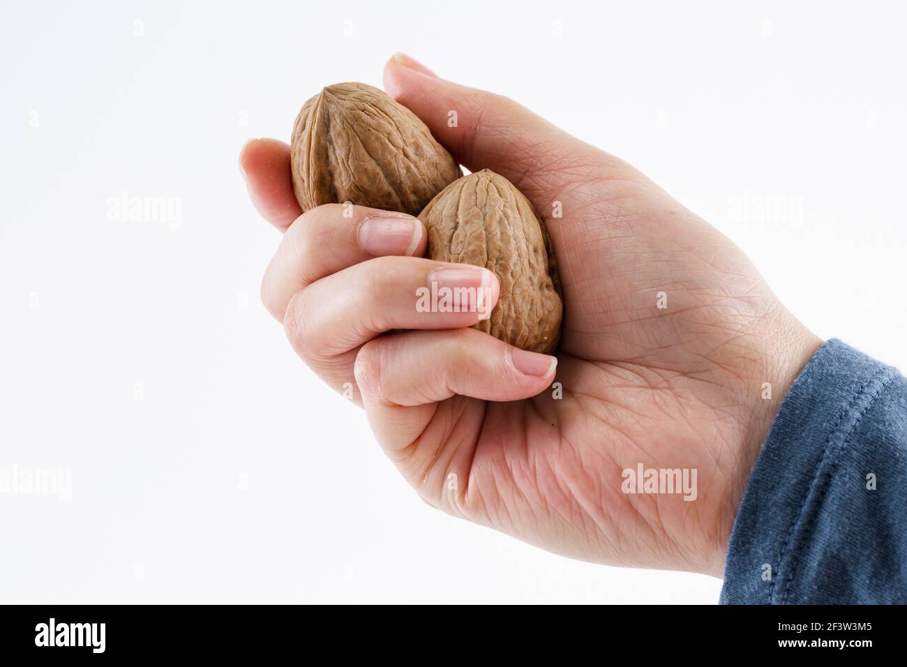 Walnuts and hands hi-res stock photography and images - Alamy