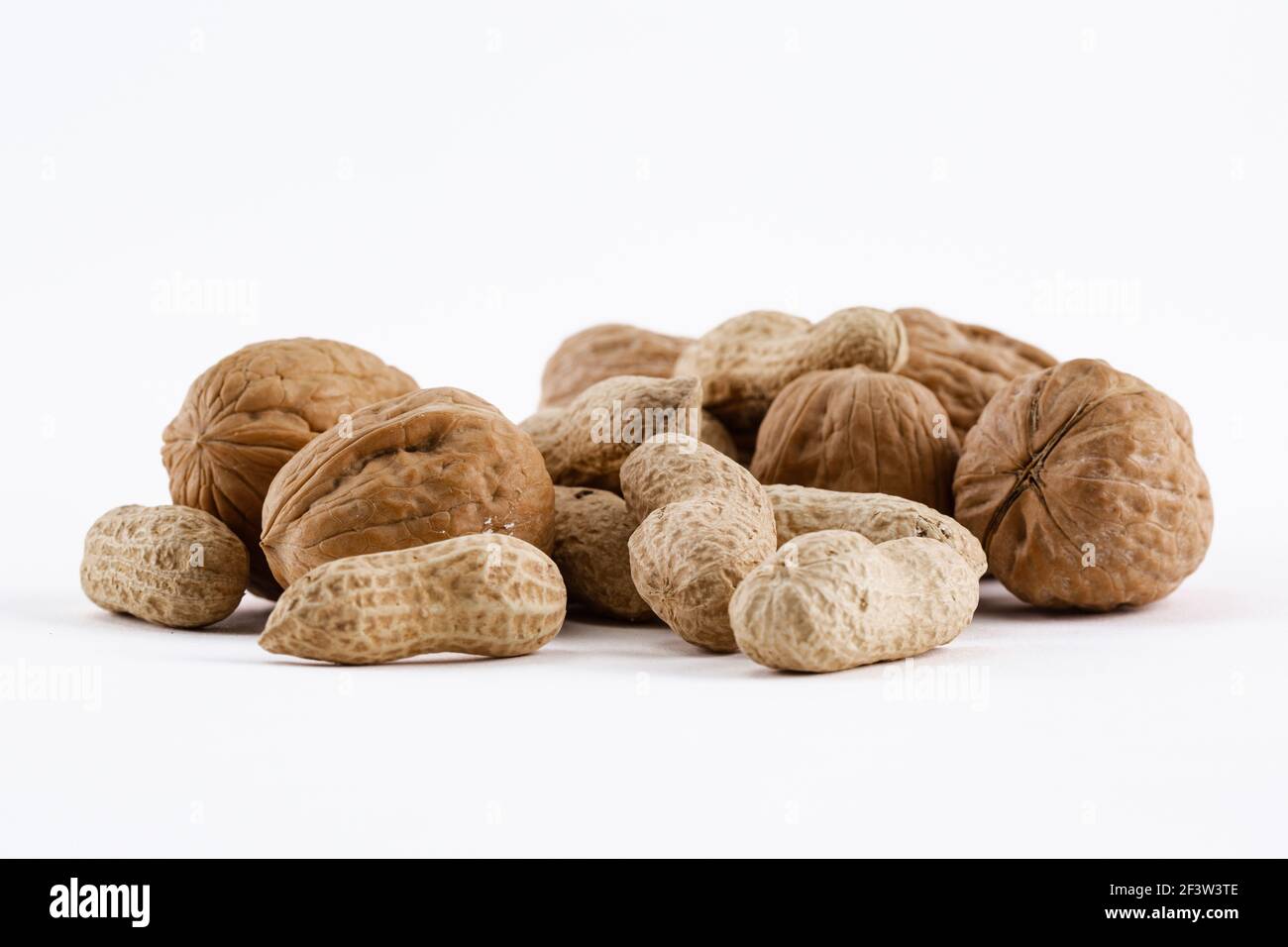 peanuts and walnuts in white background Stock Photo - Alamy