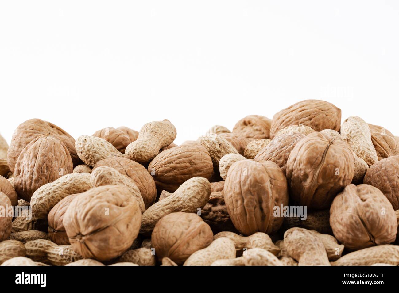 peanuts and walnuts in white background Stock Photo - Alamy
