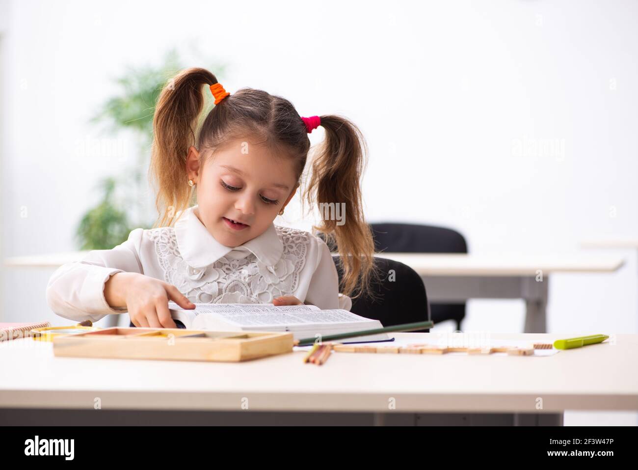 Small girl in the early development concept Stock Photo - Alamy