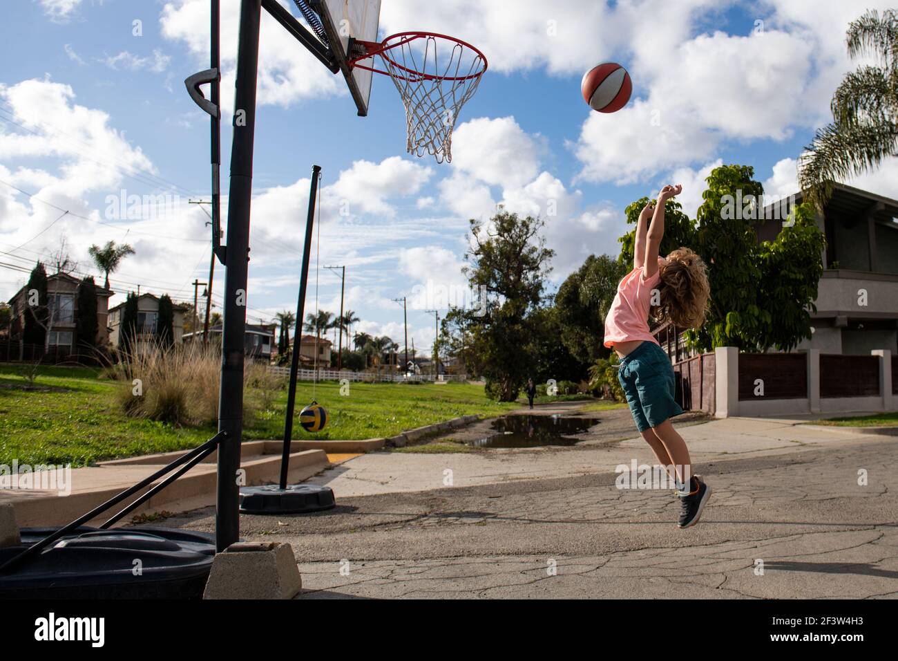 Child Shooting Basketball
