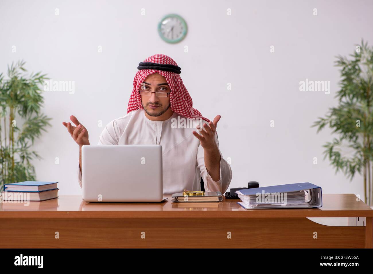 Male arab employee working in the office Stock Photo - Alamy