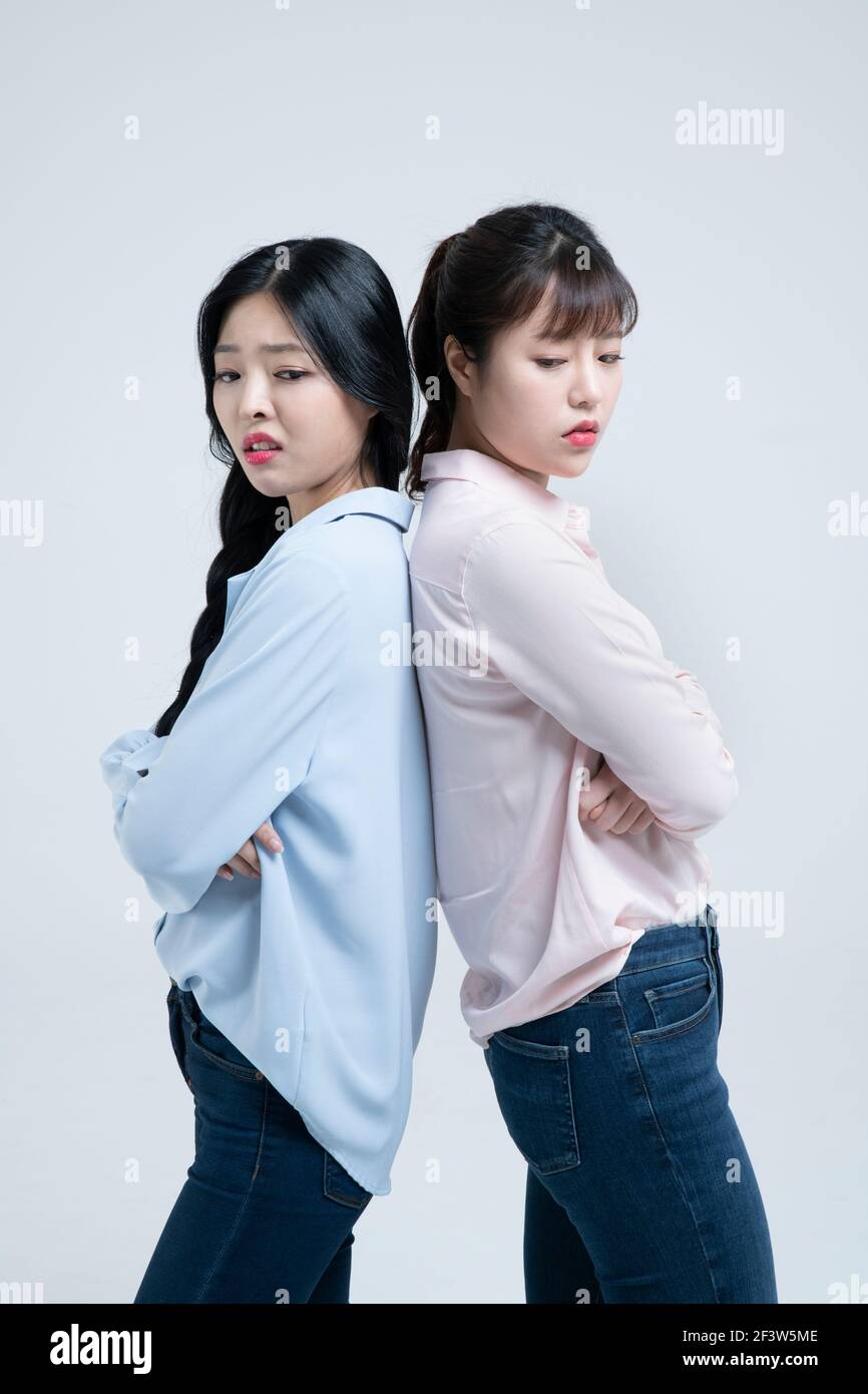 Two angry people back to back hi-res stock photography and images - Alamy