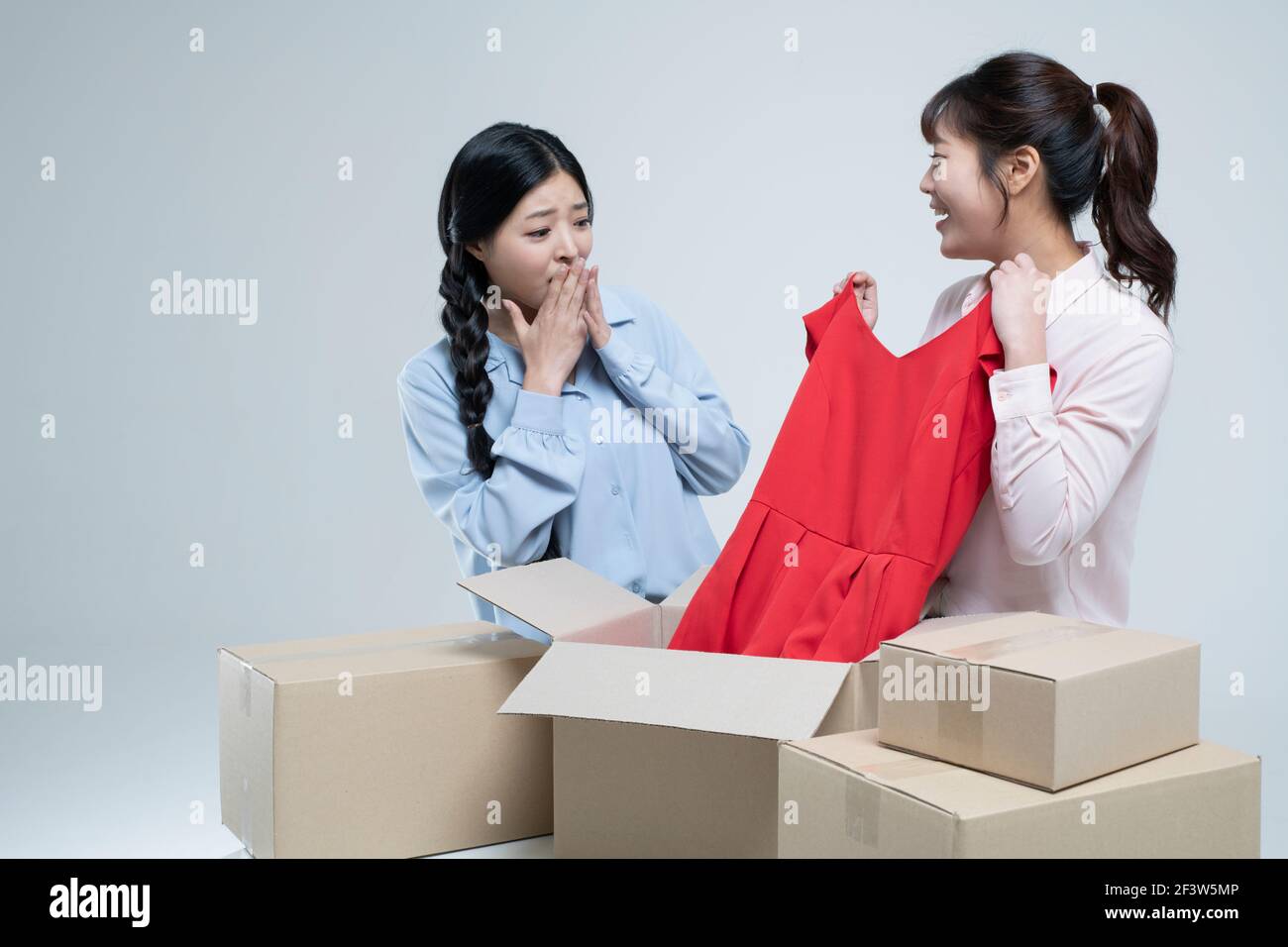 Two delivery women hi-res stock photography and images - Alamy