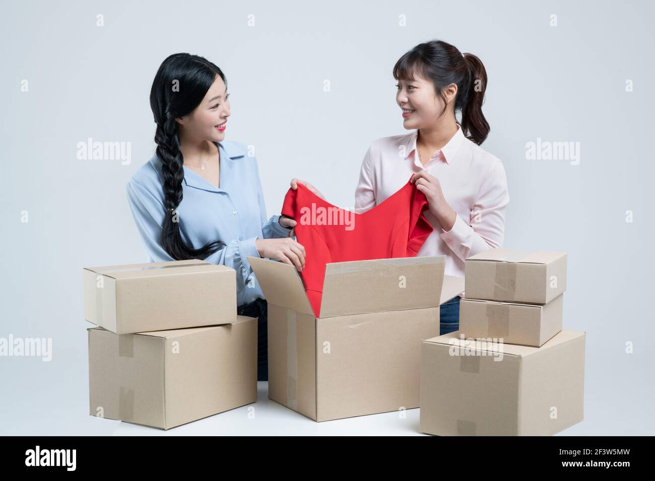 Unboxing clothing parcel hi-res stock photography and images - Alamy