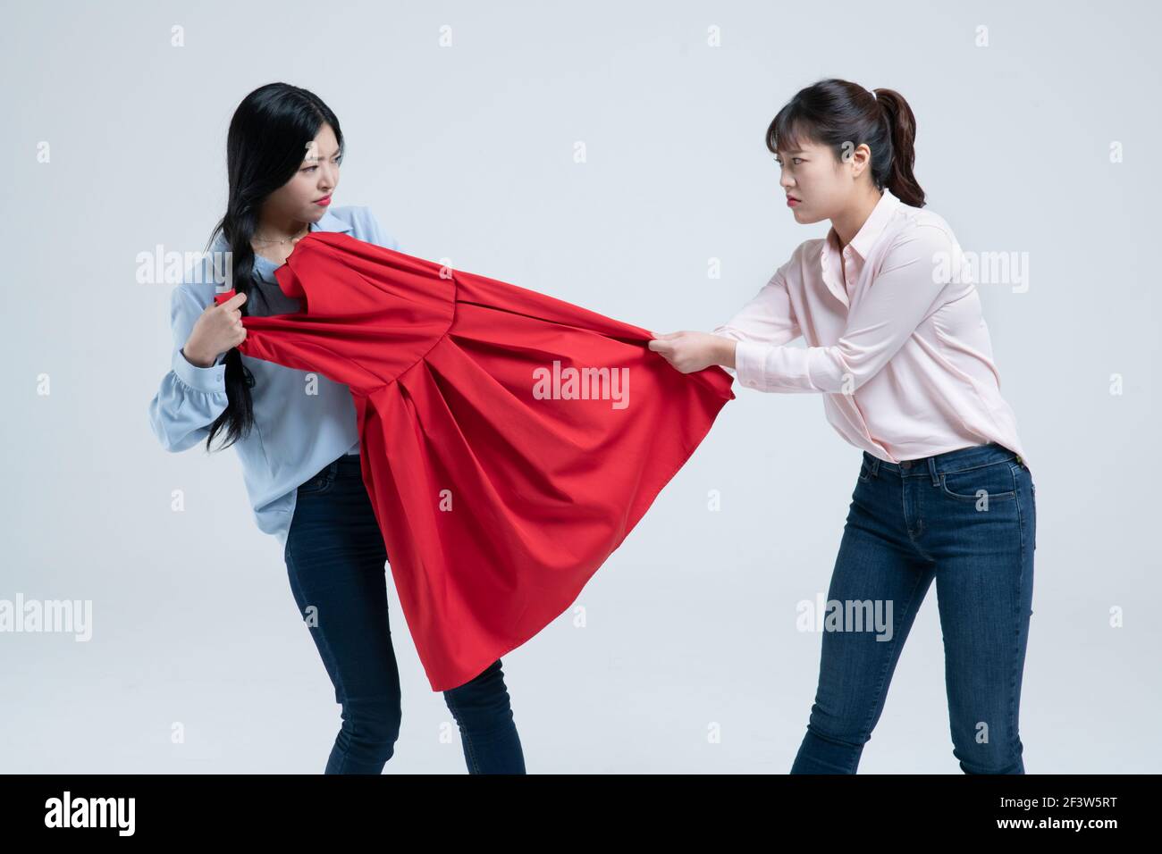 Women fighting over clothes hi-res stock photography and images - Alamy