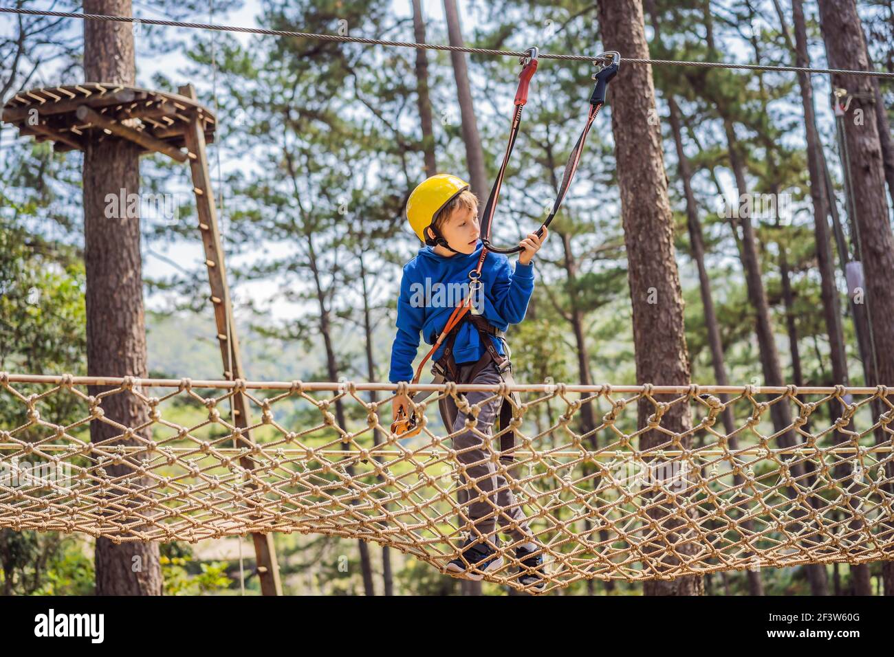Happy child in a helmet, healthy teenager school boy enjoying activity ...