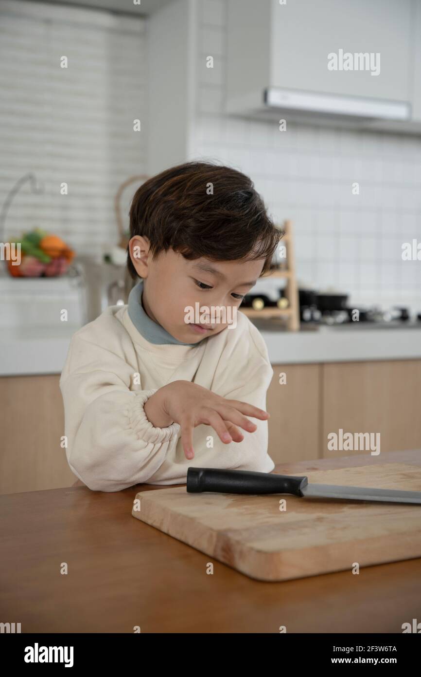child abuse concept, Asian child with no food at home searching for ...
