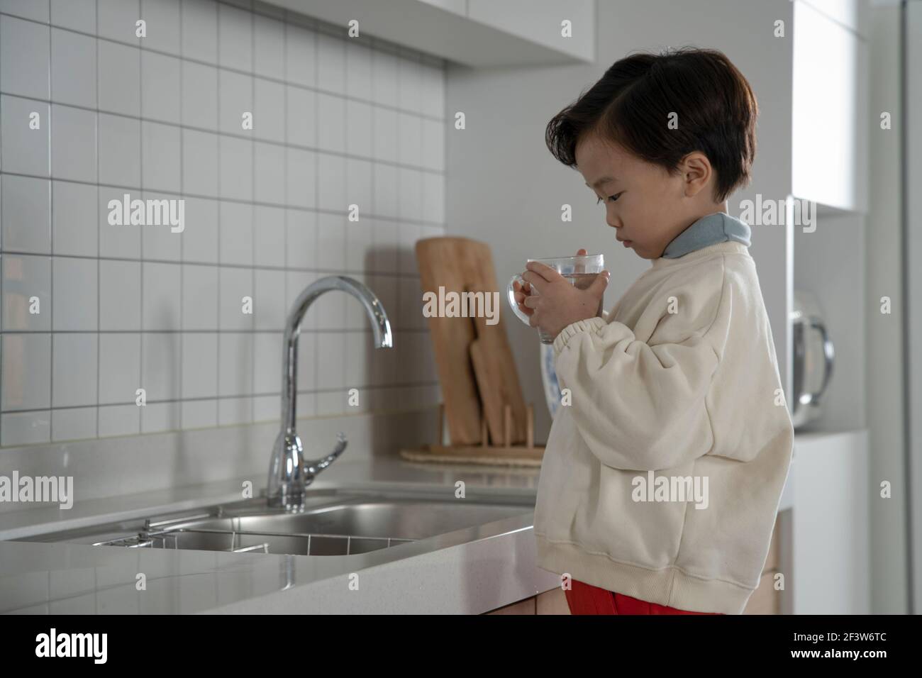 child abuse concept, Asian child with no food at home searching for ...