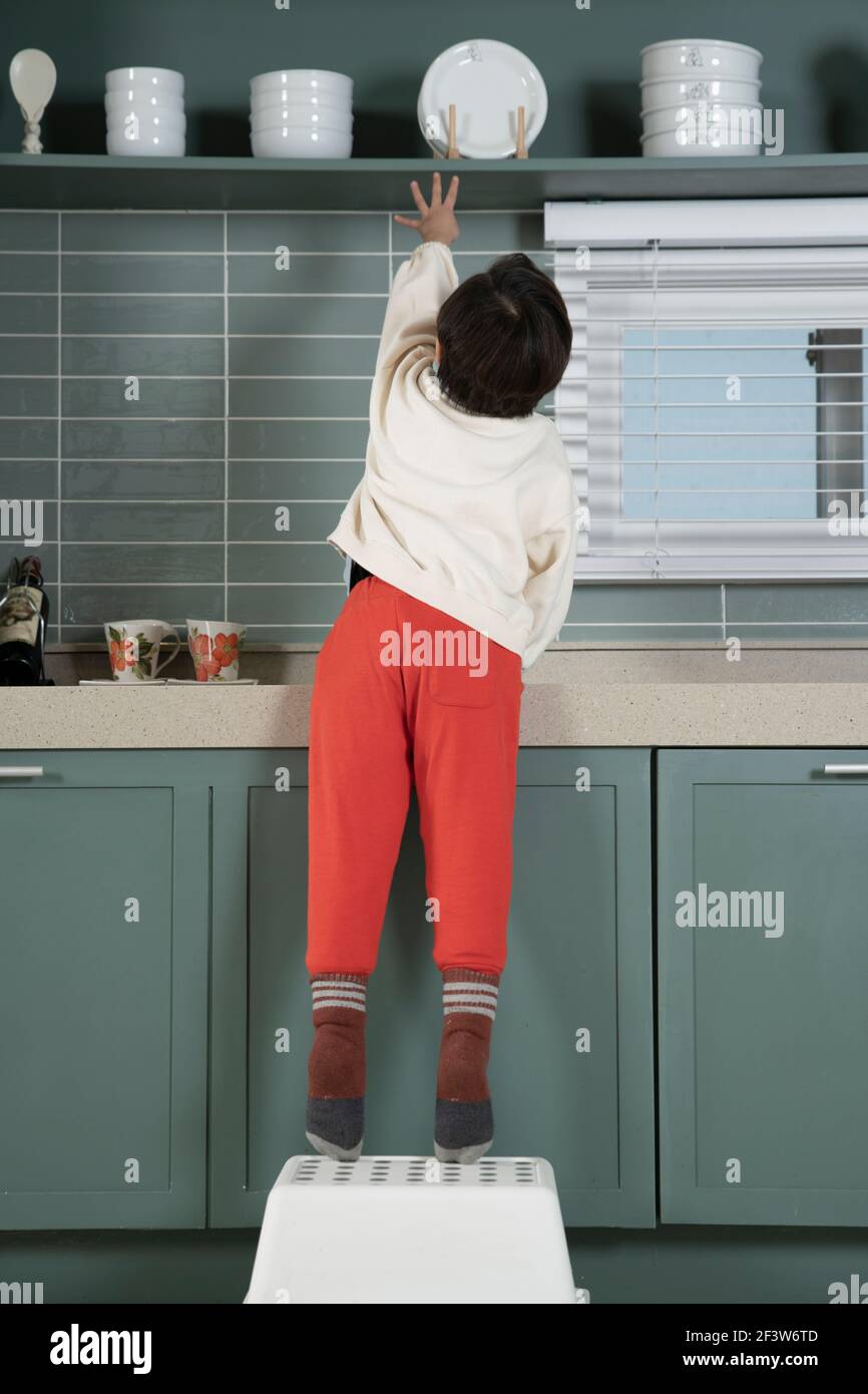 Kitchen accident with child hi-res stock photography and images - Alamy