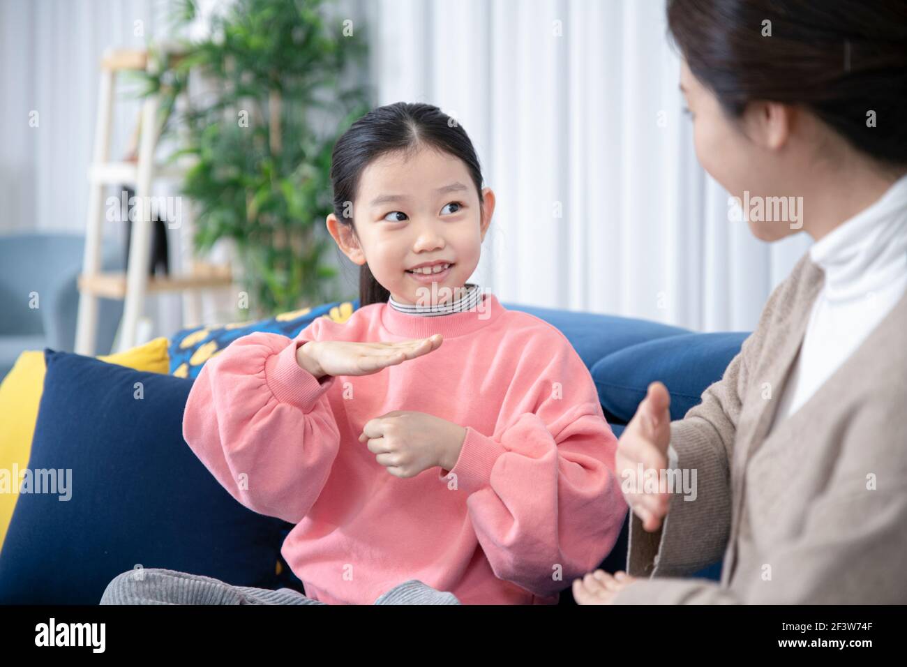 Communicating asian sign language hi-res stock photography and images ...
