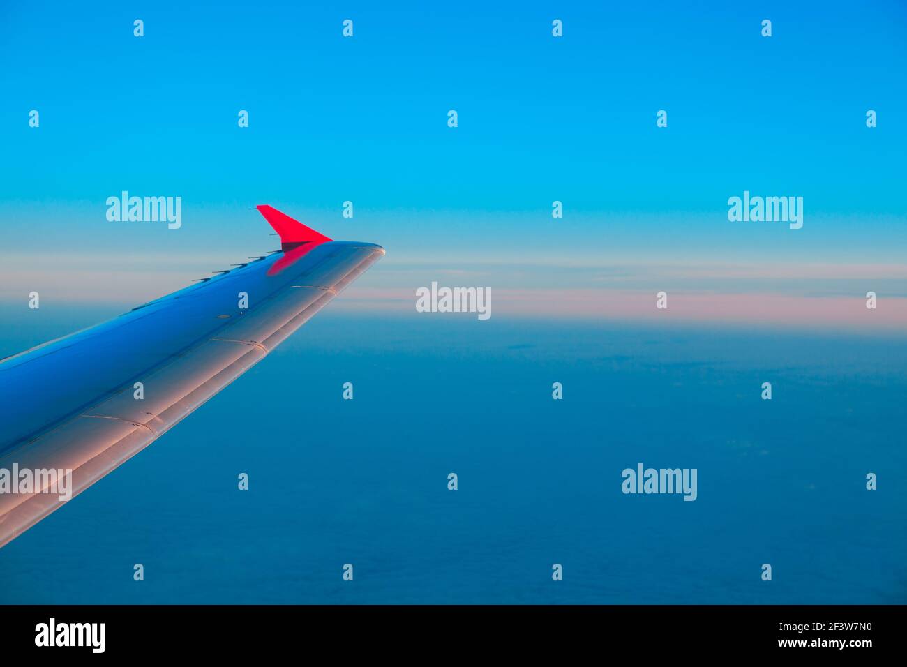 Airplane wing outside, view from interior of aircraft Stock Photo - Alamy