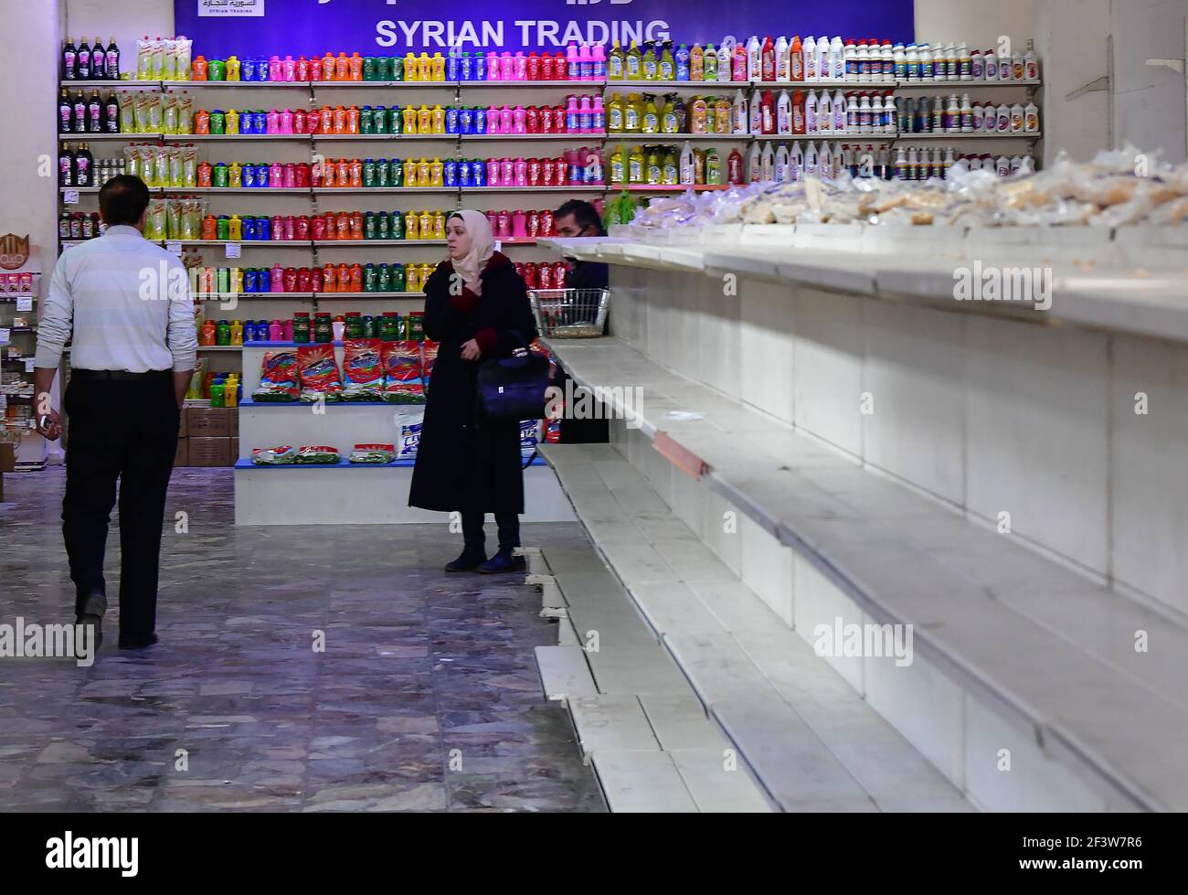 Damascus, Syria. 17th Mar, 2021. People shop at a grocery store in ...